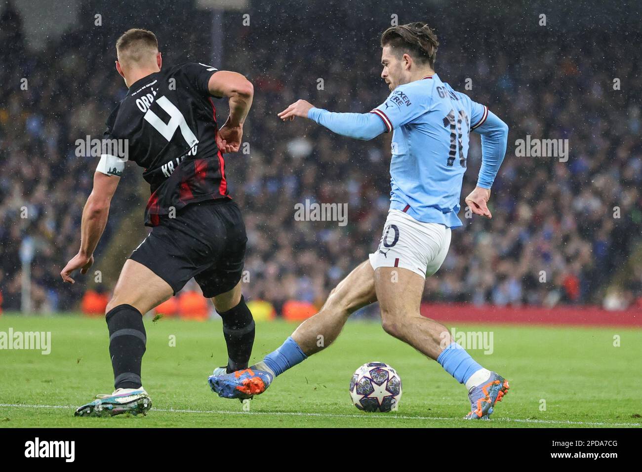 Manchester, UK. 14th Mar, 2023. Willi Orbán #4 of RB Leipzig tackles Jack Grealish #10 of ...