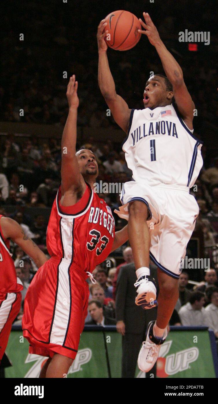 Villanova's Kyle Lowry, right, drives to the basket against Rutgers ...