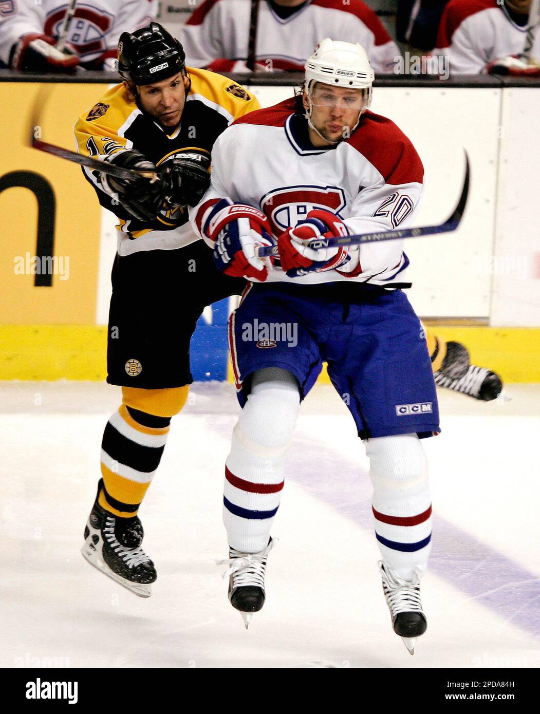 Montreal Canadiens' Richard Zednik (20) just escapes a check by Boston ...