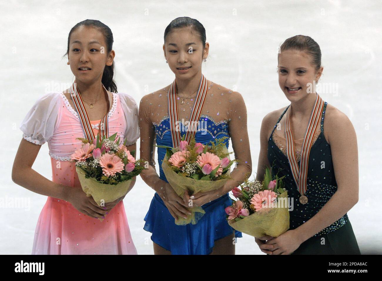 Mao Asada of Japan, left, Yu-Na Kim of Republic of Korea, center, and ...