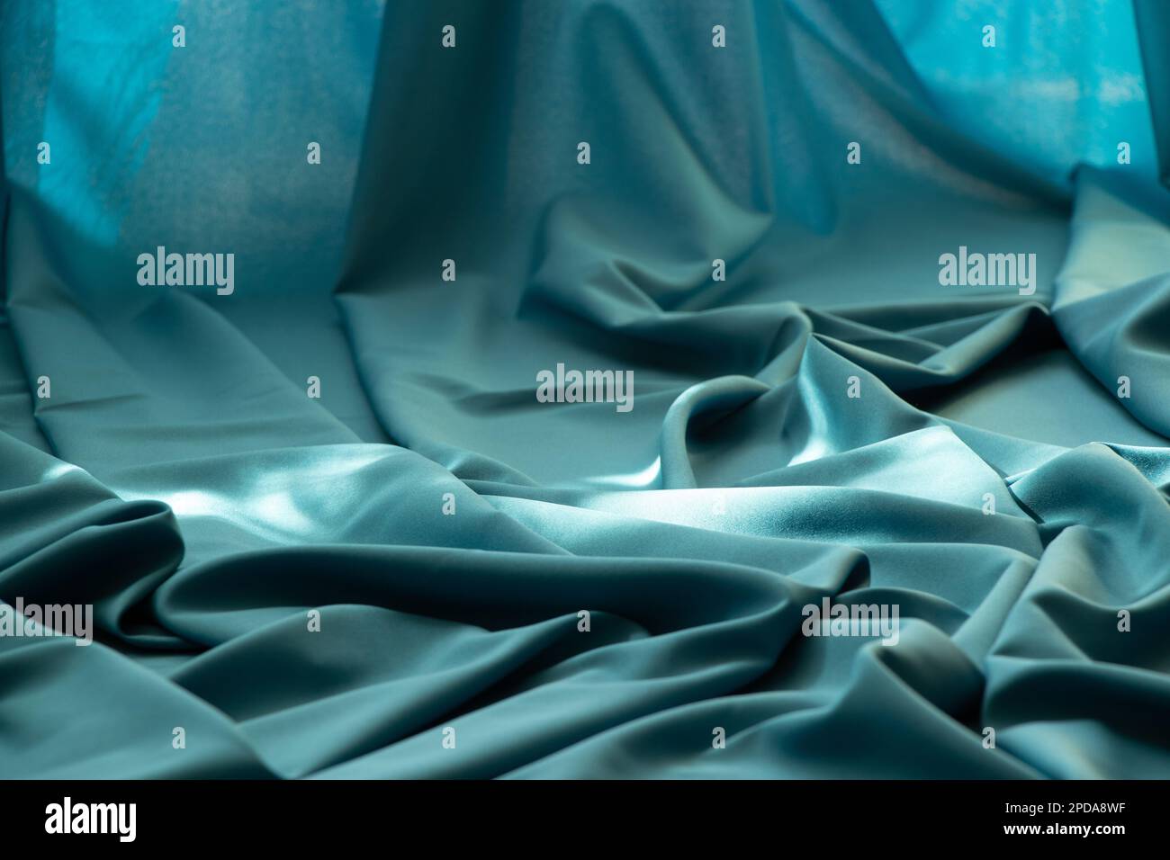 Blue wrinkled plain fabric as background Stock Photo - Alamy