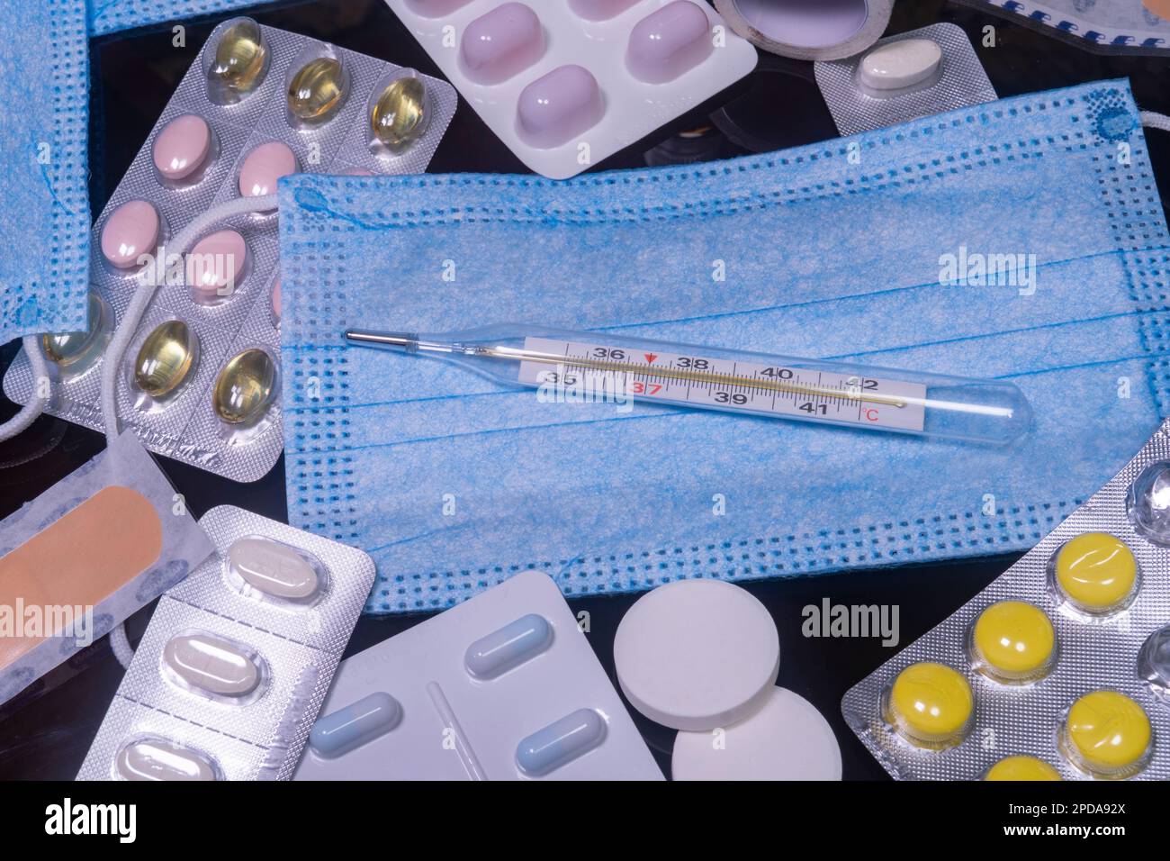 Mercury glass thermometer on the medicine table. Measurement of body ...