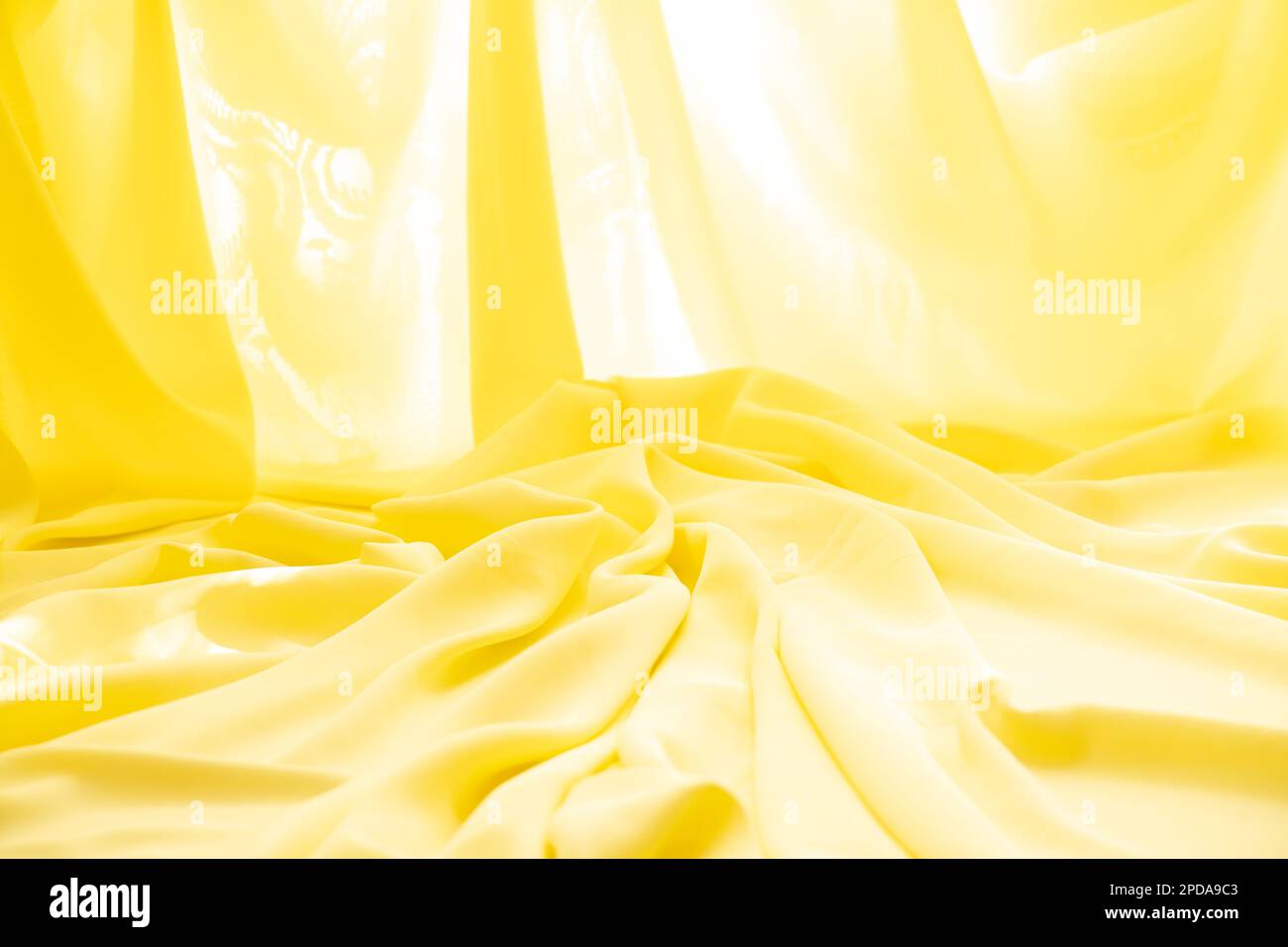 Yellow crumpled plain fabric as a background Stock Photo - Alamy