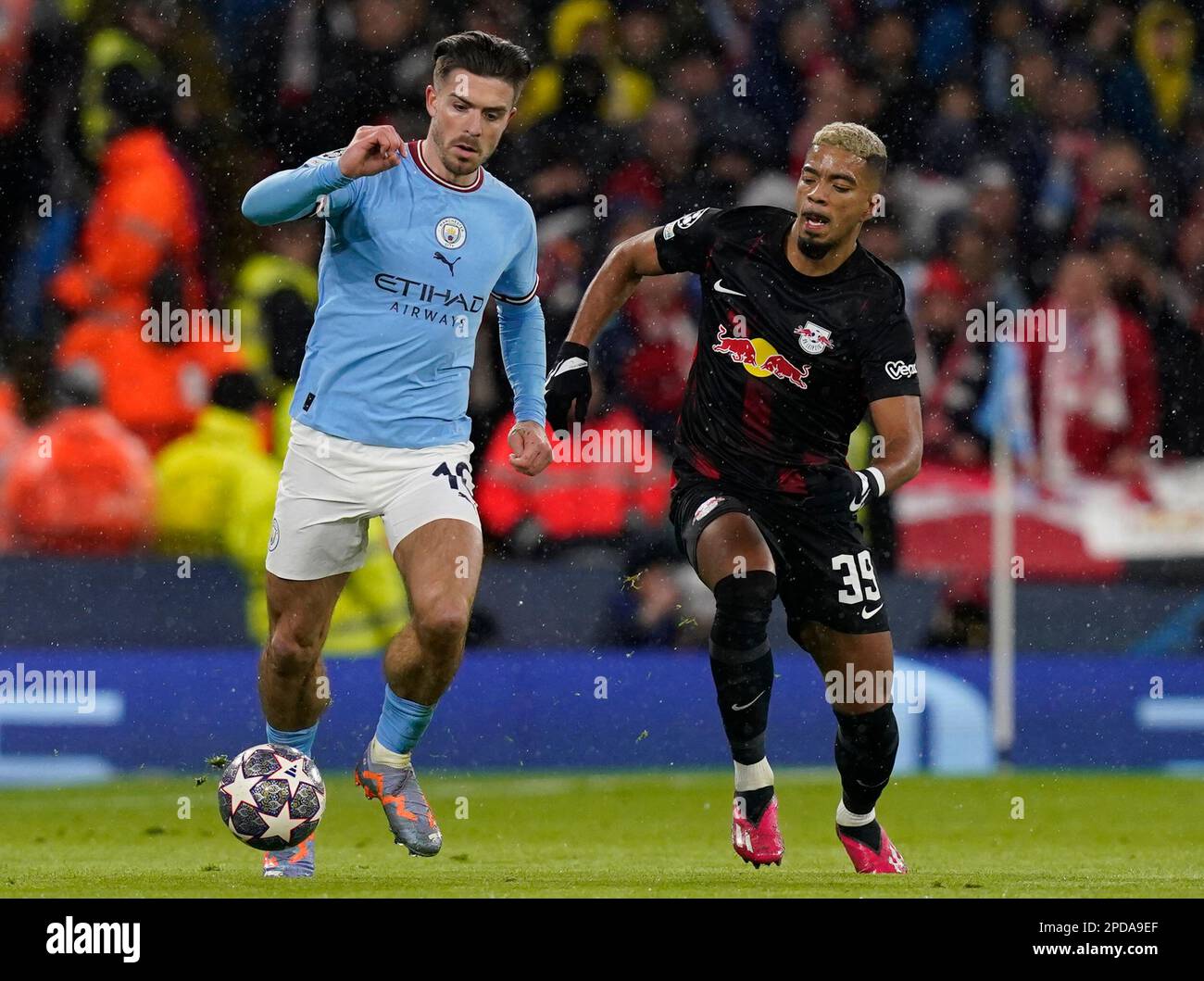 Manchester, UK. 14th Mar, 2023. Benjamin Henrichs of RB Leipzig tackles Jack Grealish of ...