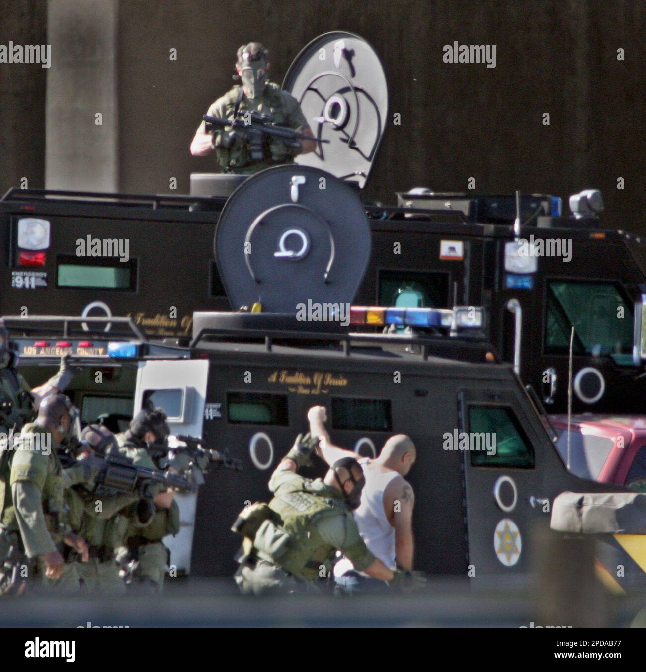 As a Los Angeles County Sheriff tactical squad covers him, Eduardo ...