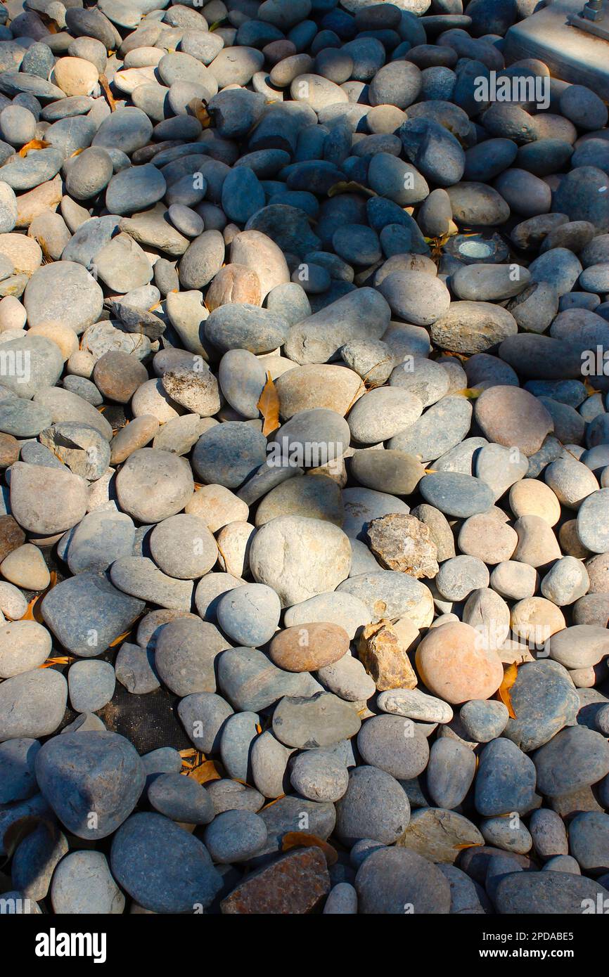 Pebble rocks on the ground Stock Photo - Alamy