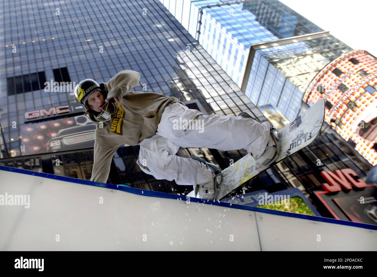 Snowboarder Graham Hoffman slides down the rail on a 100-foot ramp of ...