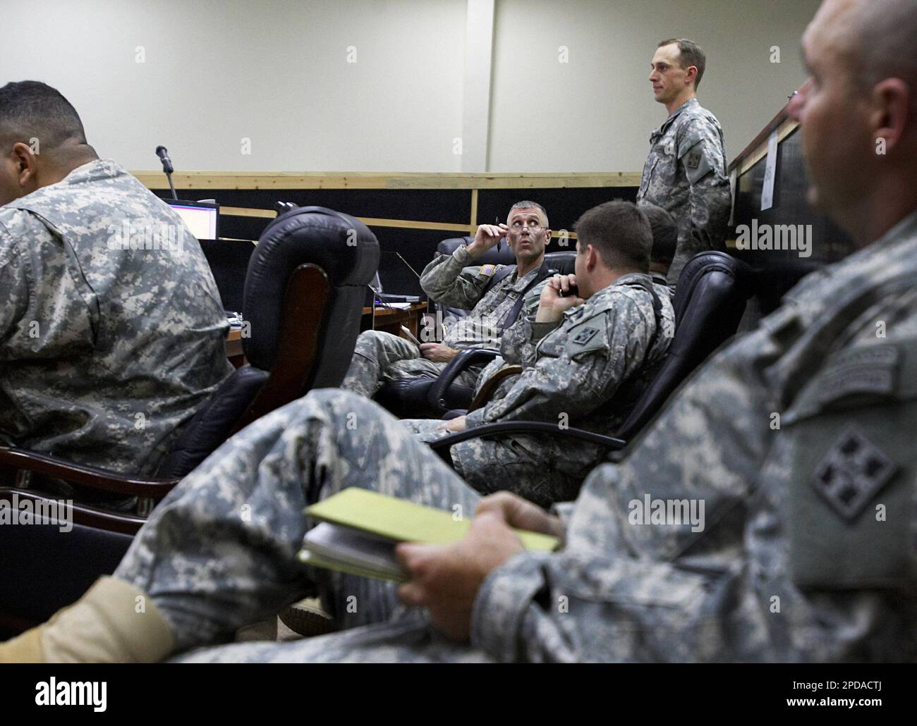 U.S. Army Col. James Pasquarette, center, talks with his senior ...