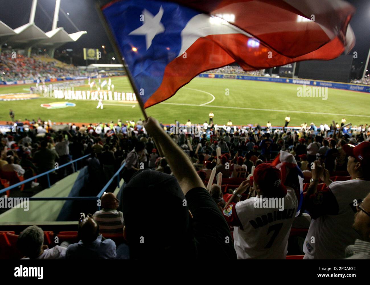 Puerto Rican fans cheer their team at the beginning of the Pool C Round ...
