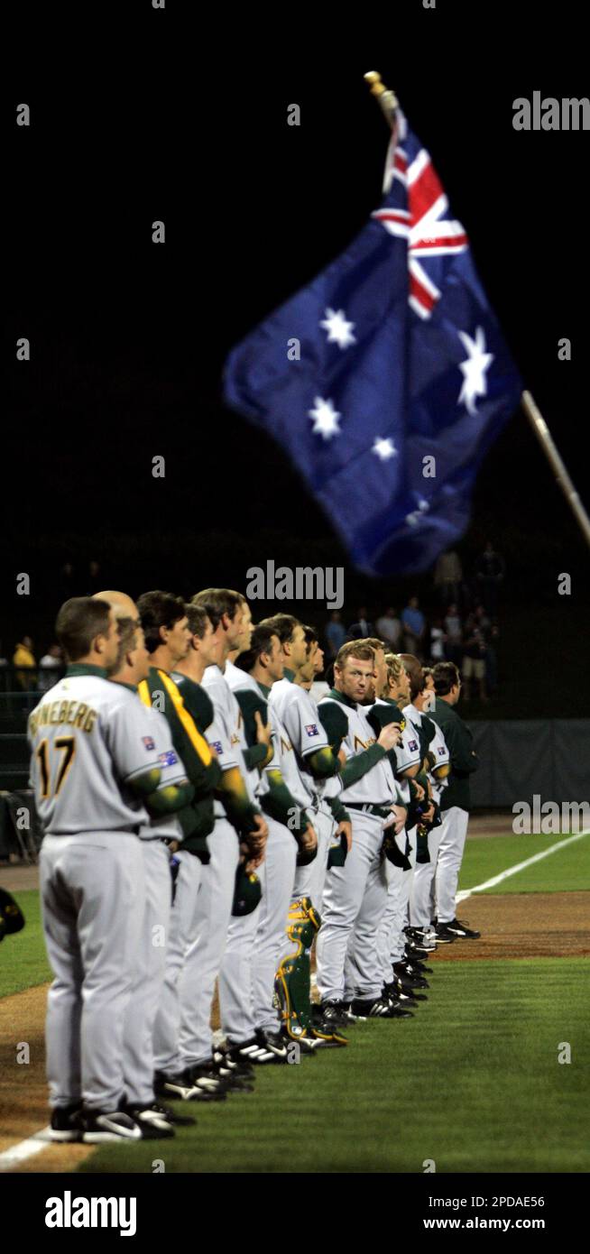 The Australian baseball team stands at attention during their countries ...