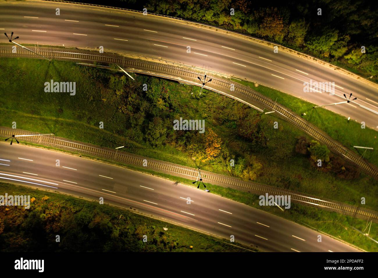 Top down view to road. Romantic night aerial photo of cars traveling ...