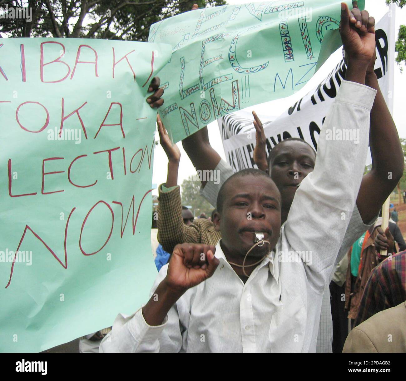 Kenyan demonstrators carry placards as they march in Nairobi, Tuesday ...
