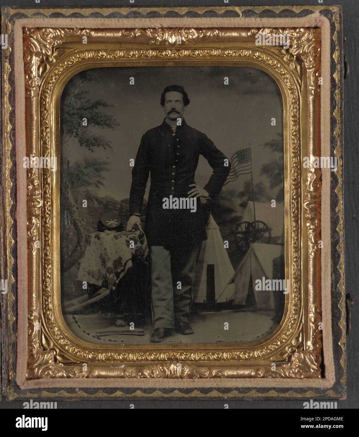 Unidentified soldier in Union uniform in front of painted backdrop ...