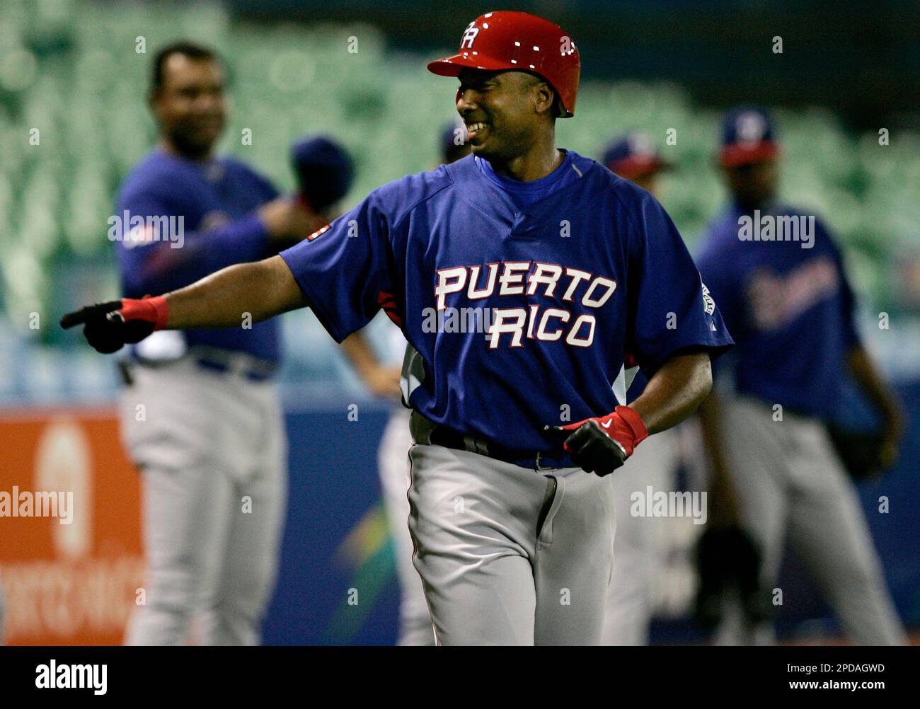 Team Puerto Rico's Bernie Williams smiles while walking by team Panama ...