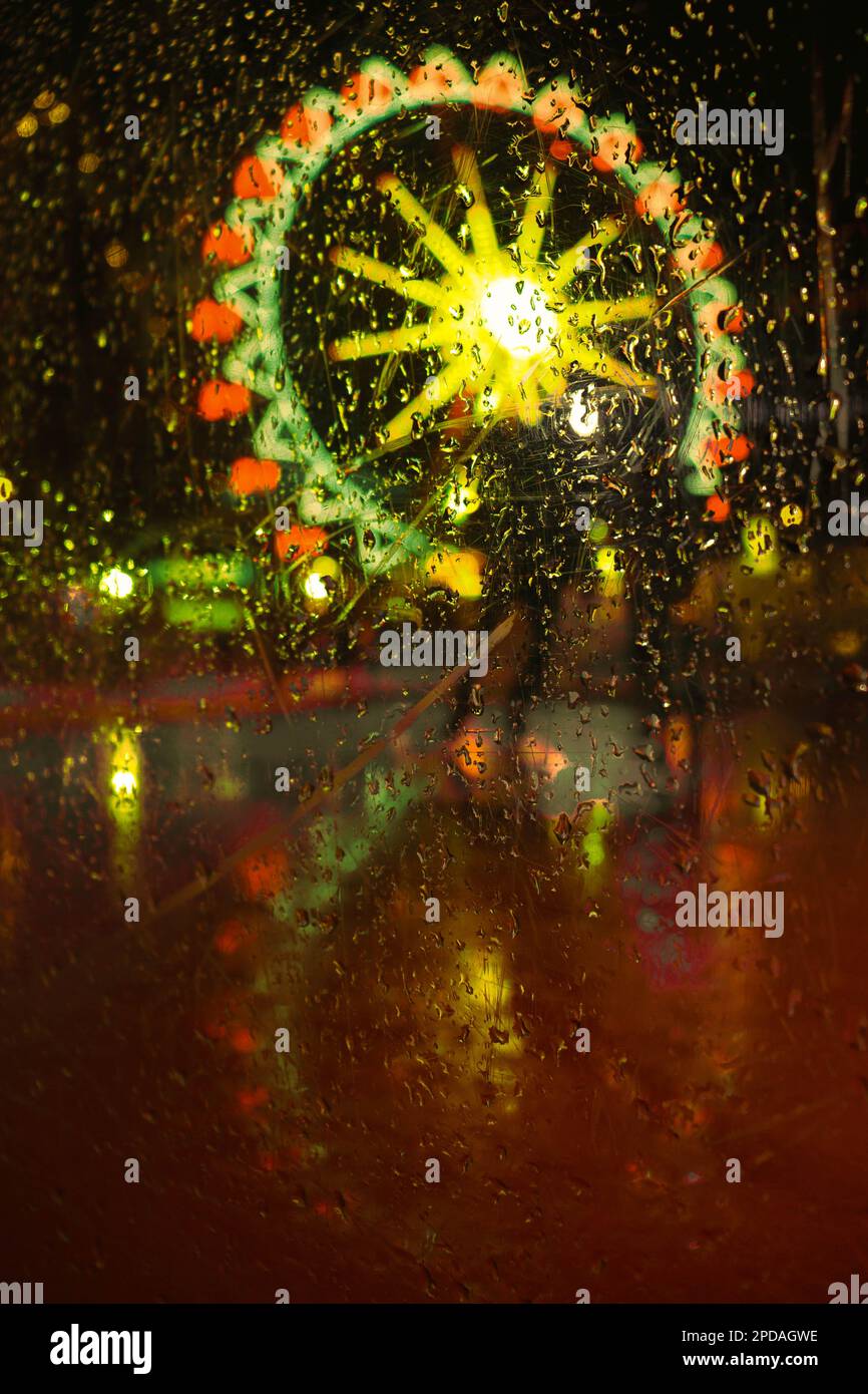 Through the glass, Fair wheel, rain drops, ice-skating Stock Photo - Alamy