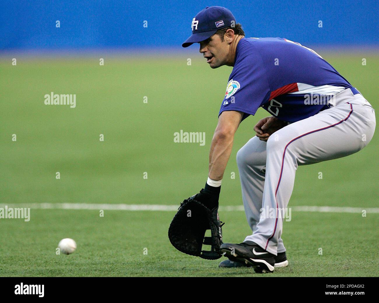 Team Puerto Rico's Javi Lopez prepares to catch a ball during a ...