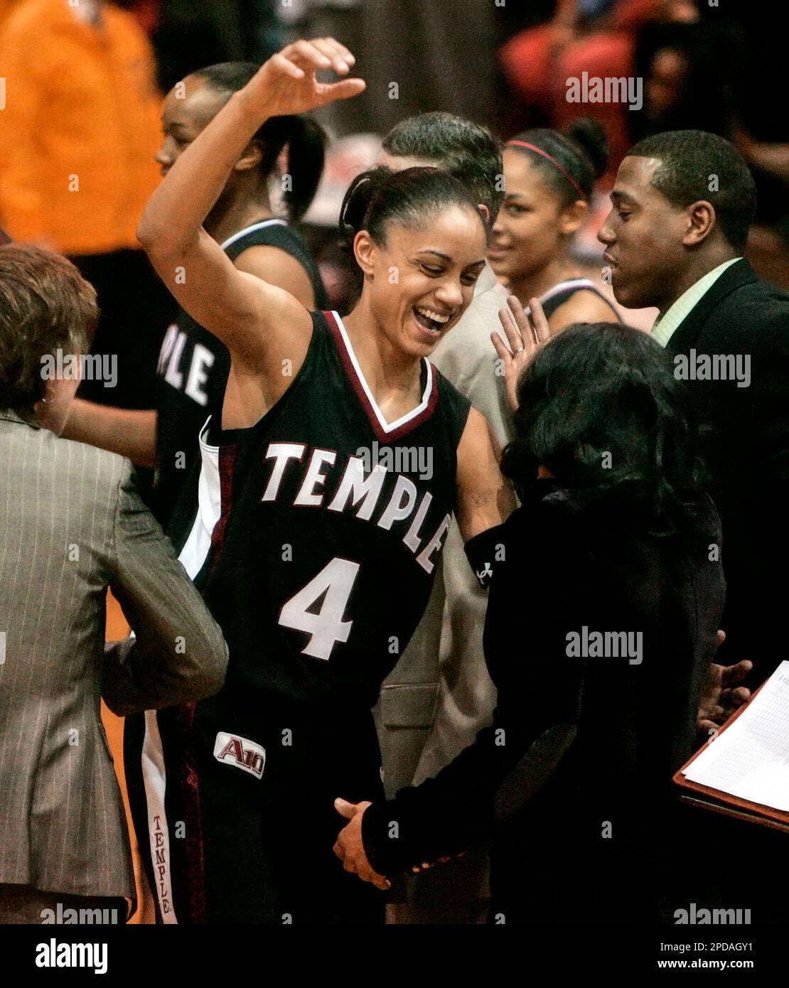 Temple's Candice Dupree (4) races to hug her coach, Dawn Staley, after ...