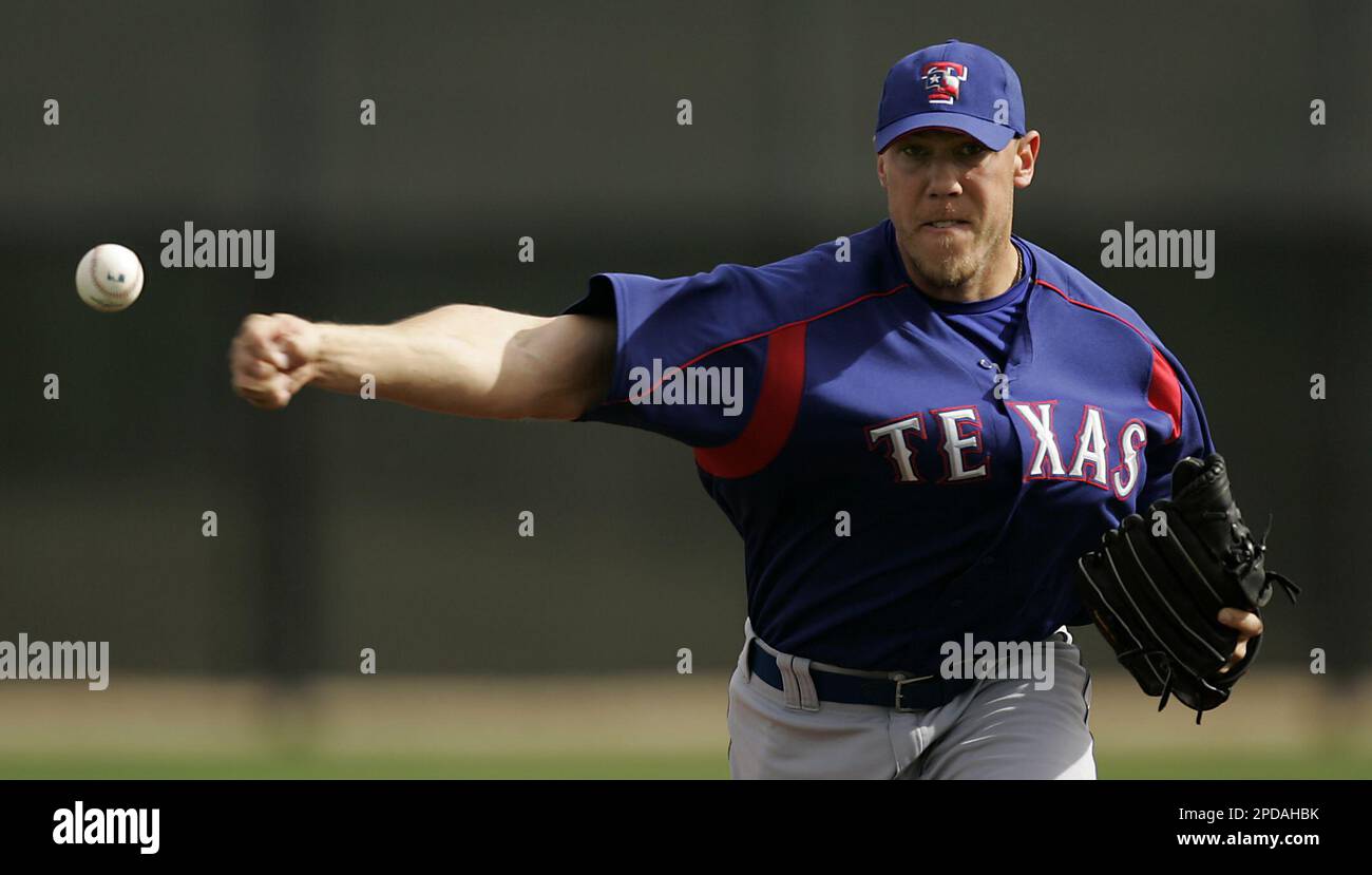 Texas Rangers' Kameron Loe throws during a spring training baseball ...