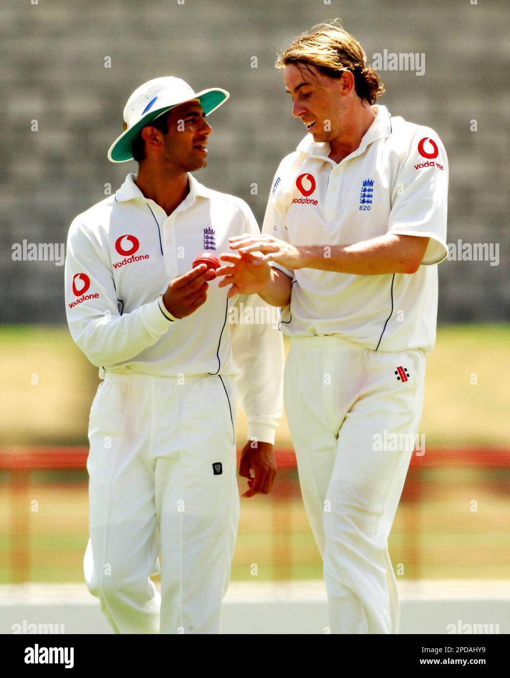 England A captain Vikram Solanki, left, speaks with teammate bowler ...