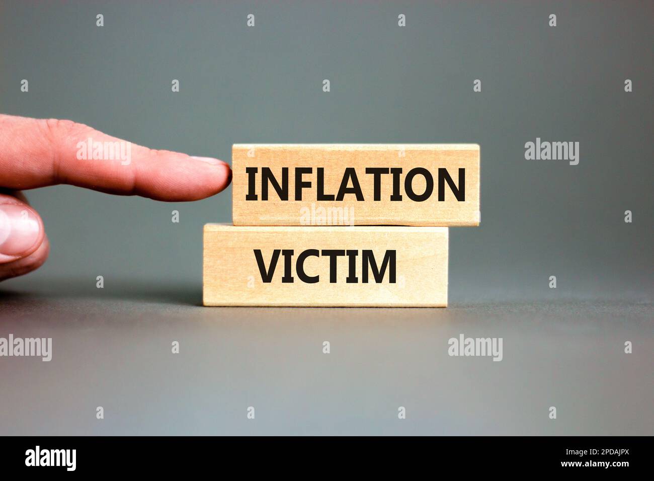 Inflation victim symbol. Concept words Inflation victim on wooden block ...