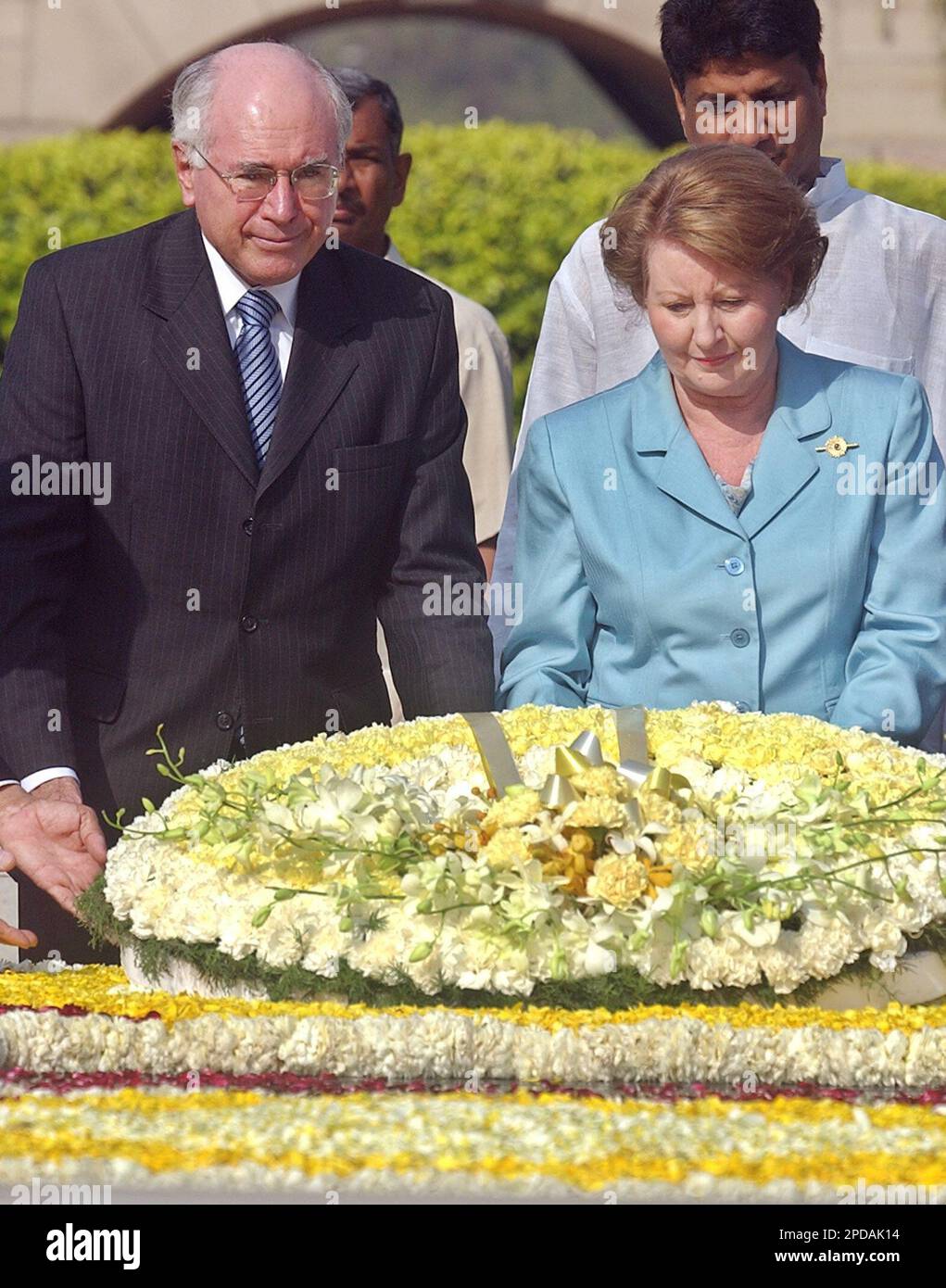 Australian Prime Minister John Howard, left, and his wife Janette lay a ...