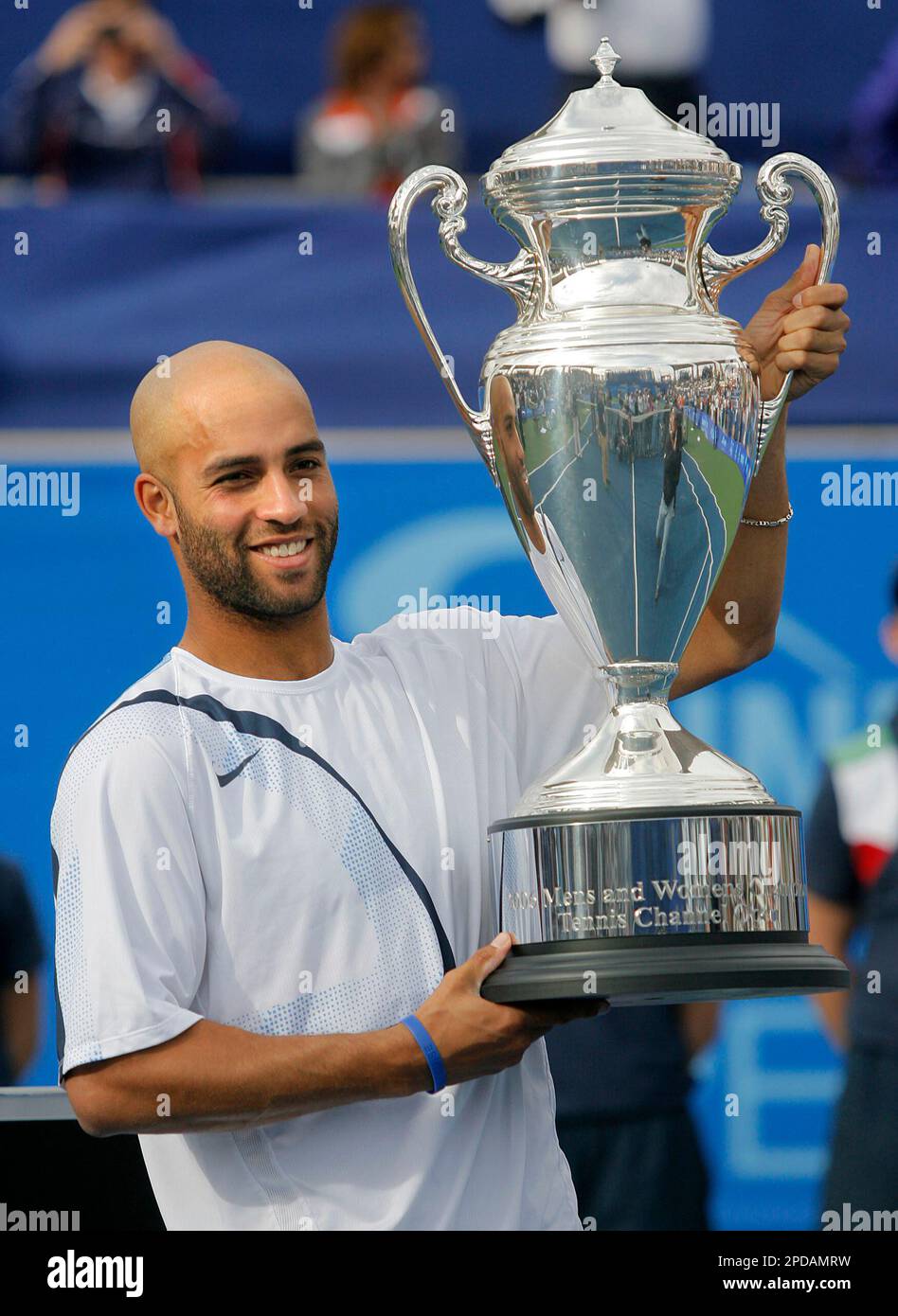 James Blake poses with a trophy after winning the Tennis Channel Open ...