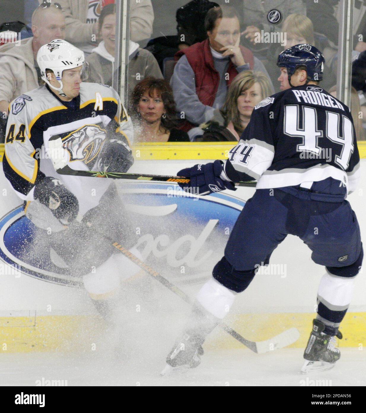 Edmonton Oilers' Chris Pronger, right, battles for control of the puck ...