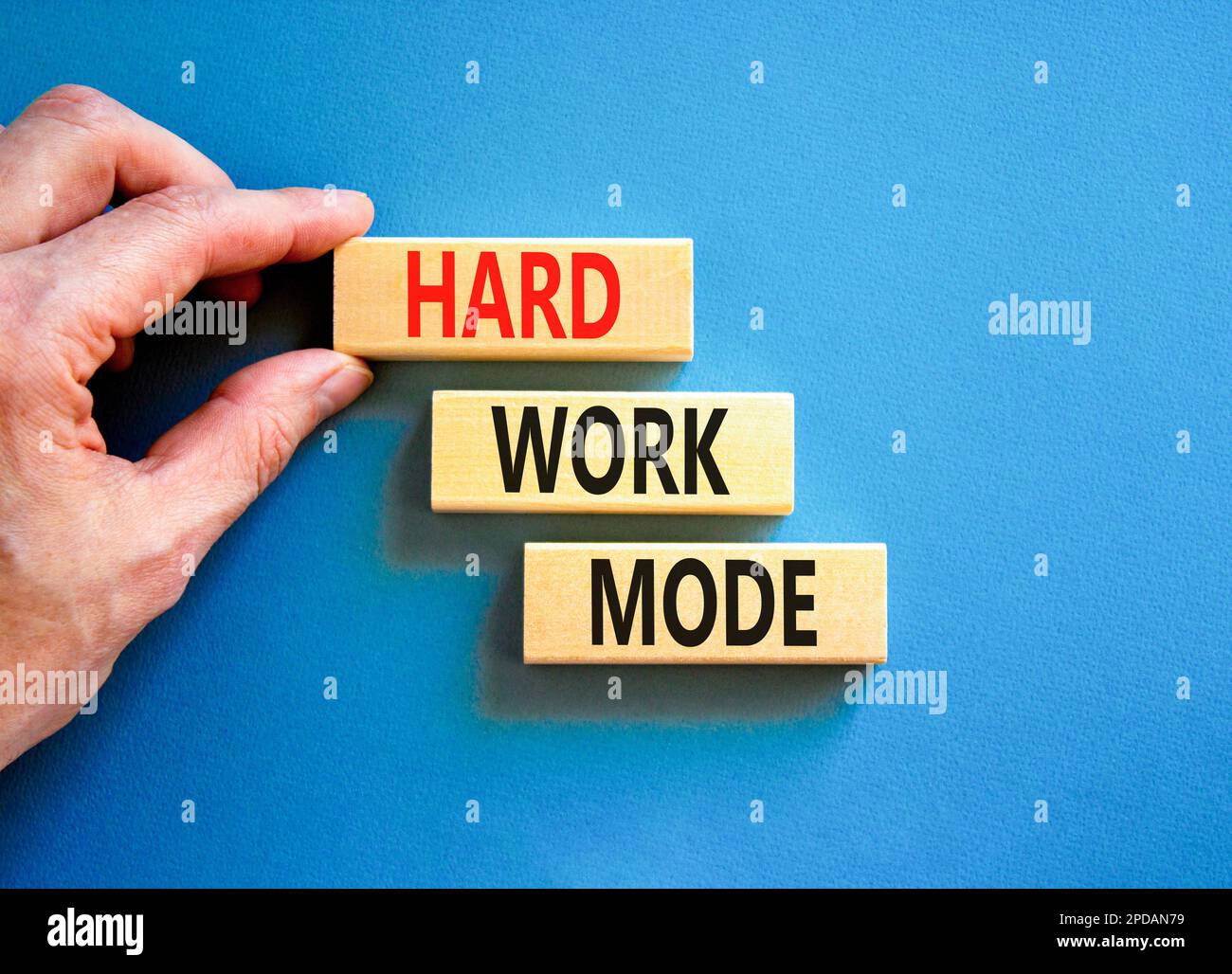 Hard work mode symbol. Concept words Hard work mode on wooden block on ...