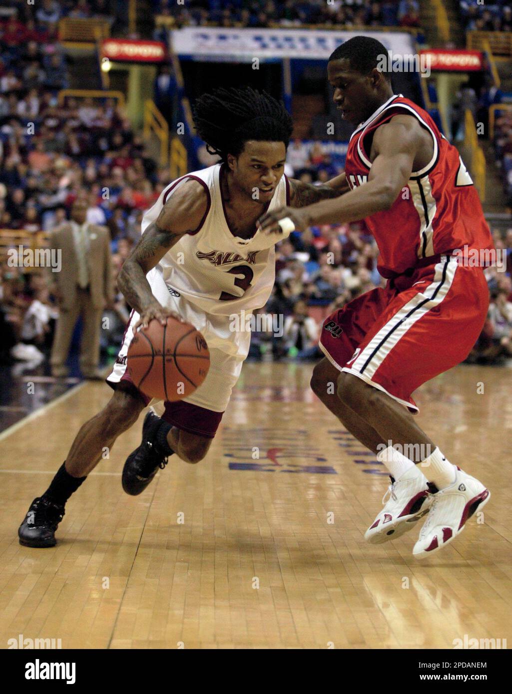 Southern Illinois' Jamal Tatum, left, drives around Bradley's Daniel ...