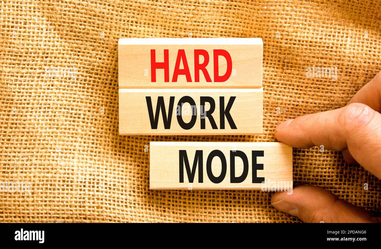 Hard work mode symbol. Concept words Hard work mode on wooden block on ...