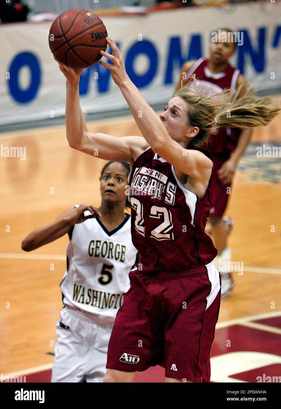 Saint Joseph's Faith Schutte (22) shoots as George Washington's ...