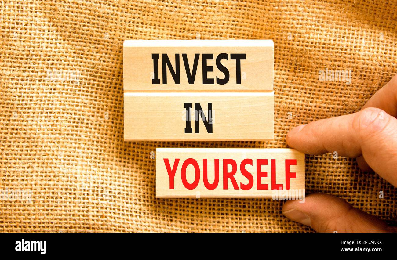 Invest in yourself symbol. Concept words Invest in yourself on wooden ...