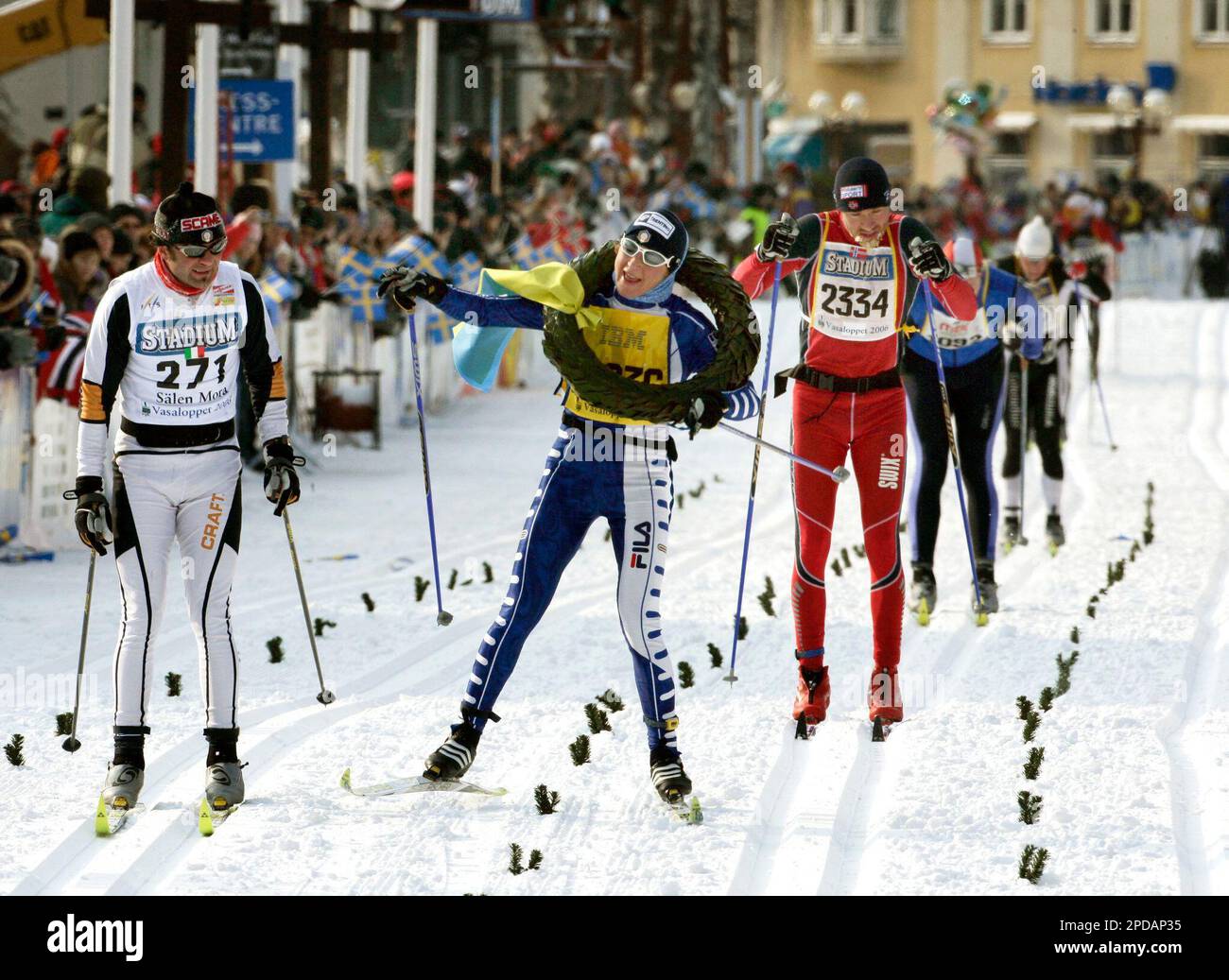 Italy's Christina Paluselli, center, crosses the finish line as the ...
