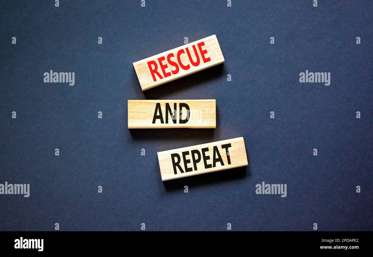Rescue and repeat symbol. Concept words Rescue and repeat on wooden block on a beautiful black ...