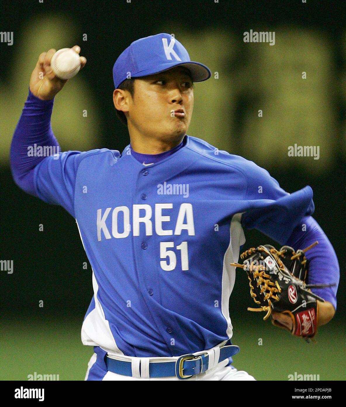 South Korea's starter Kim Sun-woo of the Colorado Rockies winds up to ...