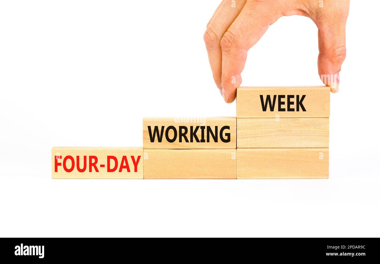 Four-day working week symbol. Concept words Four-day working week on wooden block on a beautiful ...