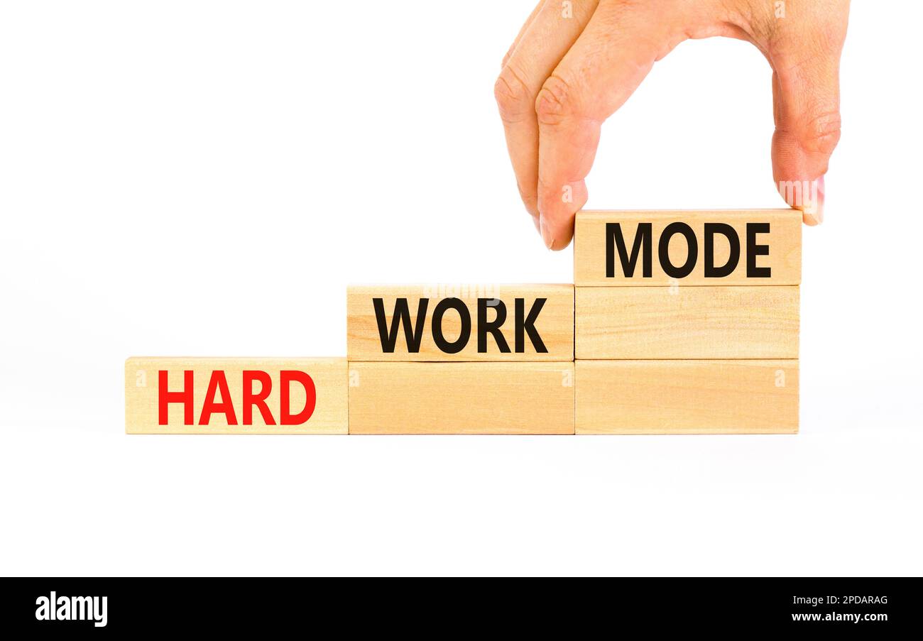 Hard work mode symbol. Concept words Hard work mode on wooden block on ...