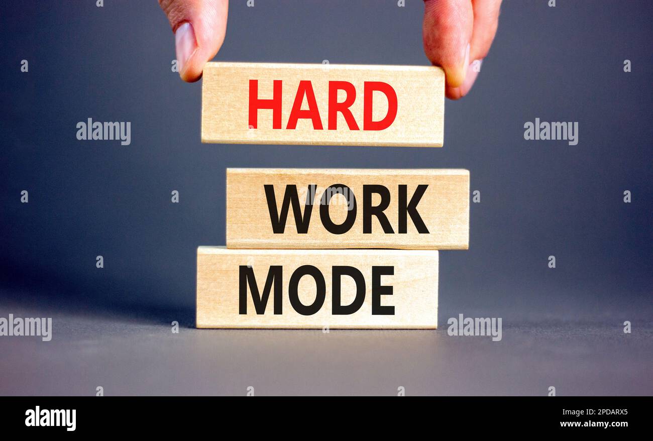 Hard work mode symbol. Concept words Hard work mode on wooden block on ...