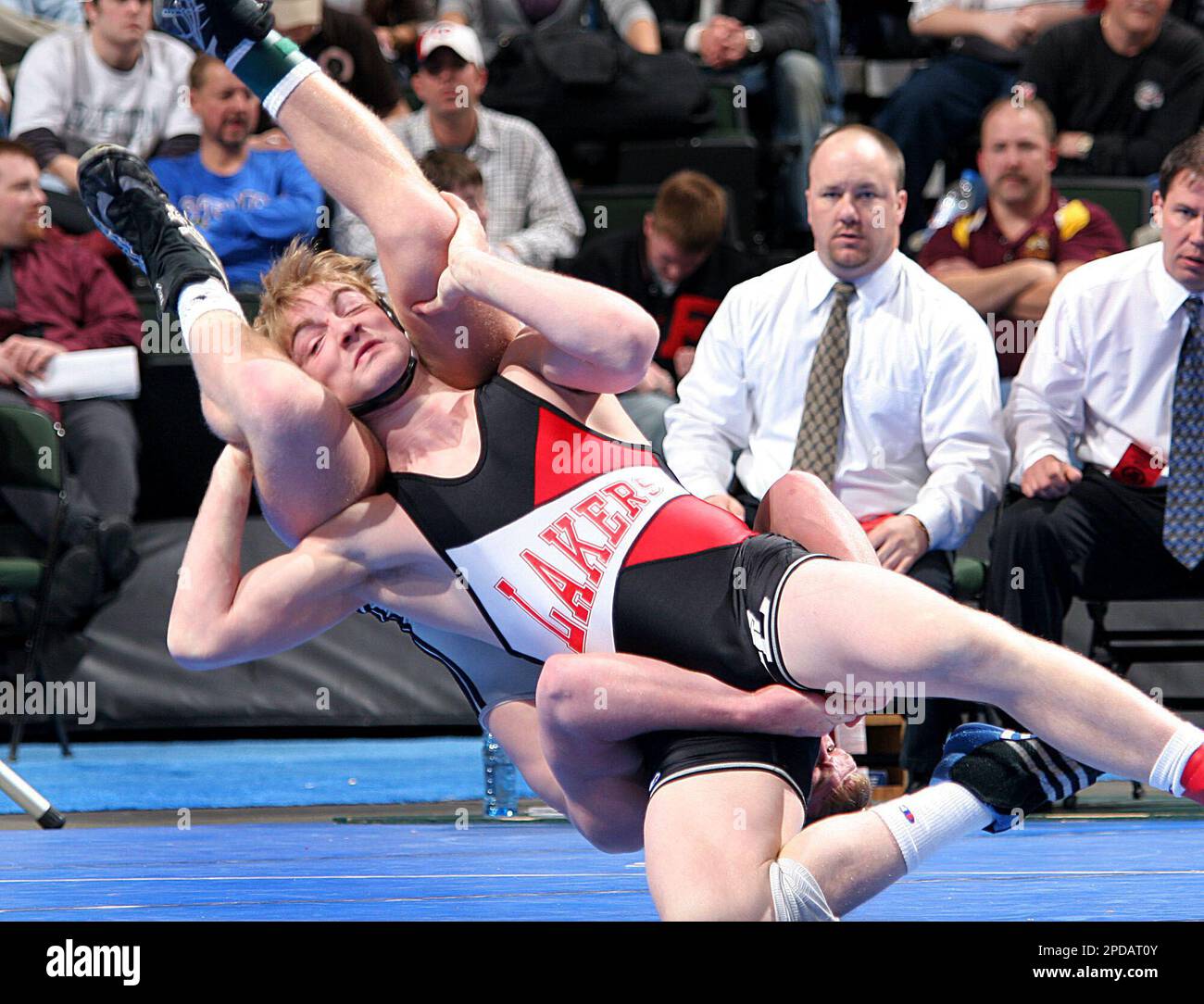 Detroit Lakes' Brent Eidenchink, front, throws Fulda's Nick Henning in ...