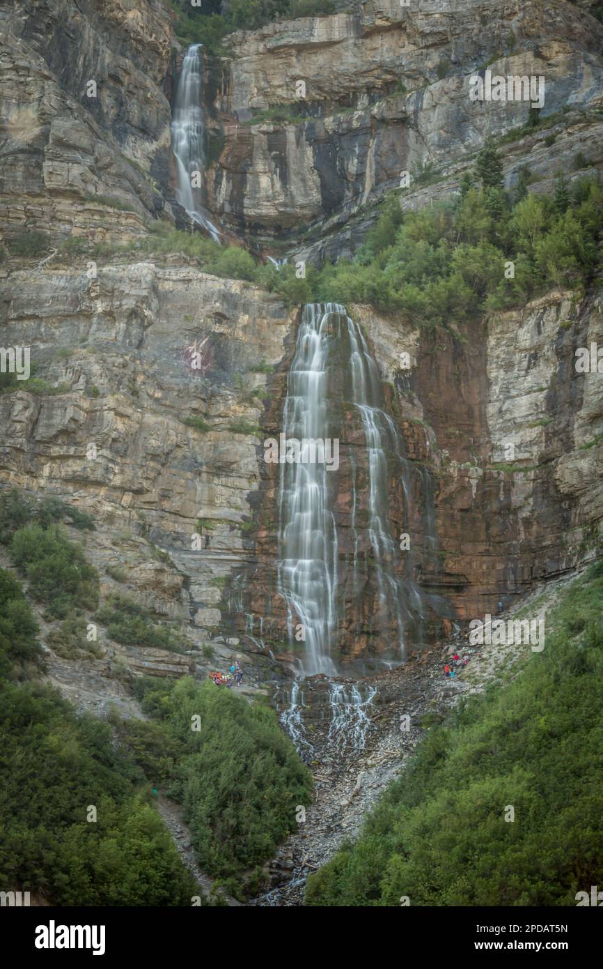 Two waterfalls coming down mountain cliff Stock Photo - Alamy