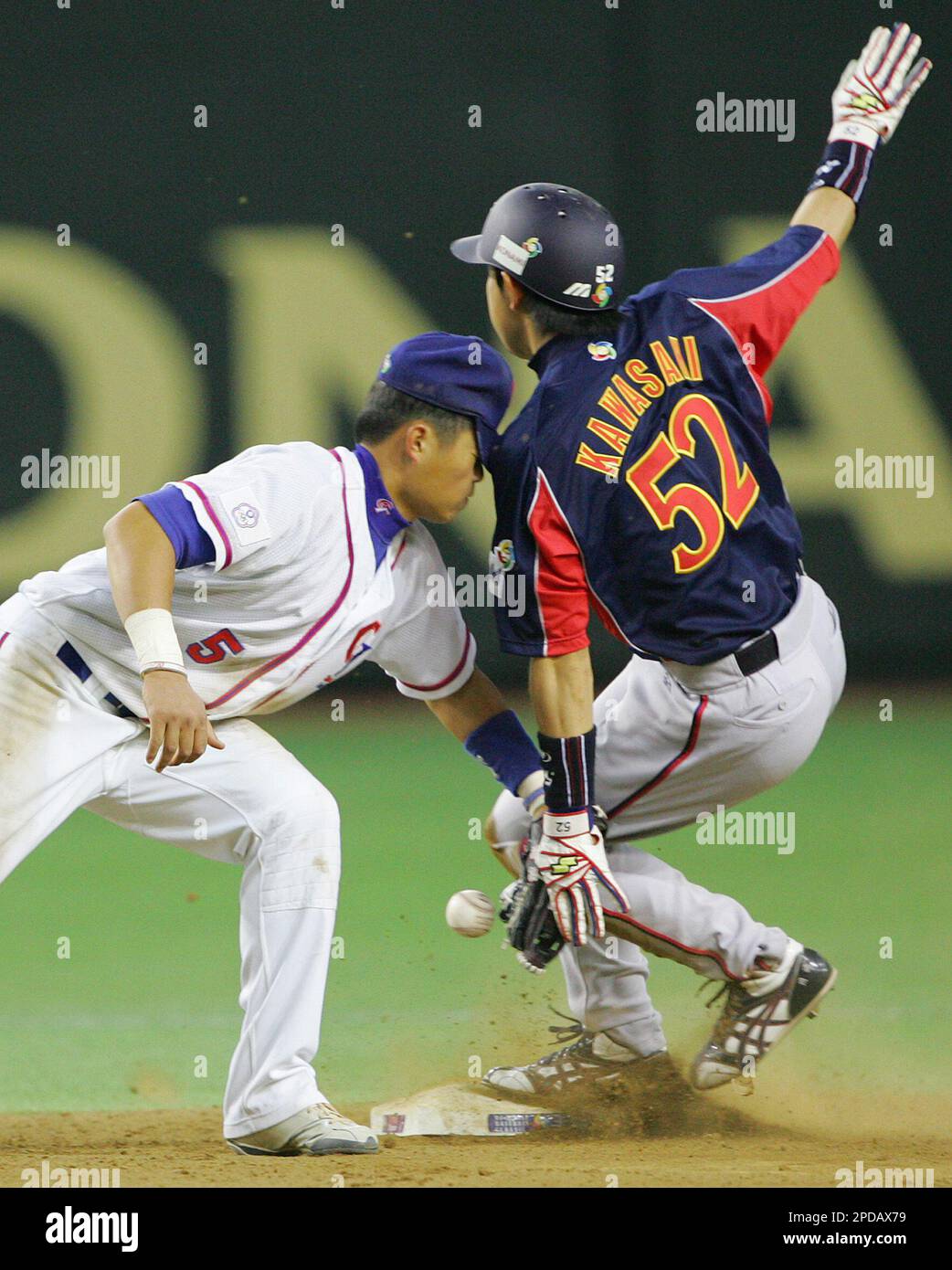 Japan's Munenori Kawasaki (52) slides into second as Taiwan's Hu Chin ...