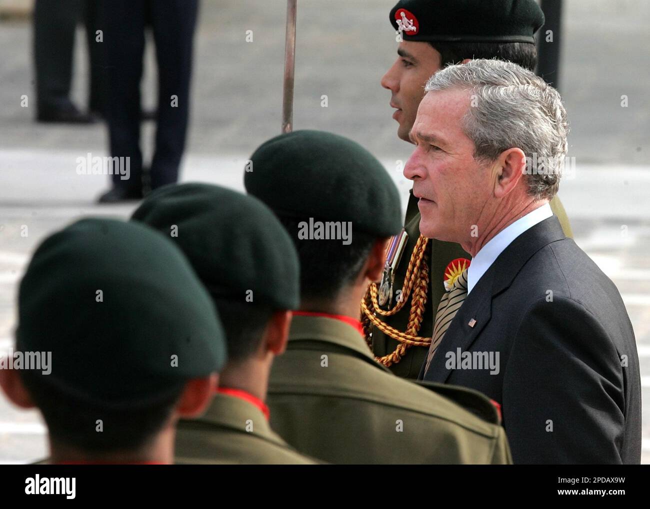 U.S. President George W. Bush, right, reviews guard of honor at ...