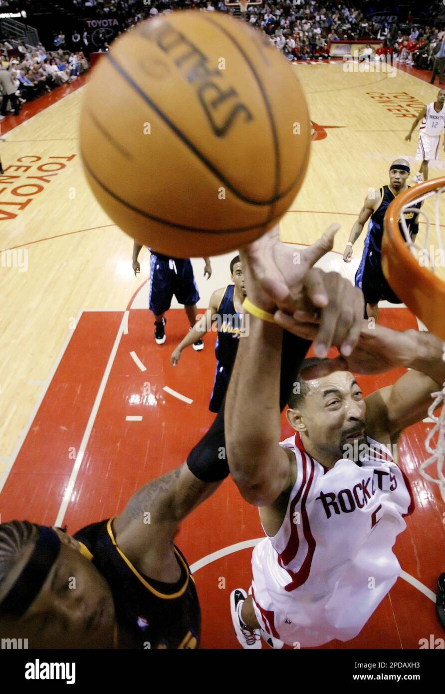 Houston Rockets' Juwan Howard (5) is fouled by Denver Nuggets' Carmelo ...