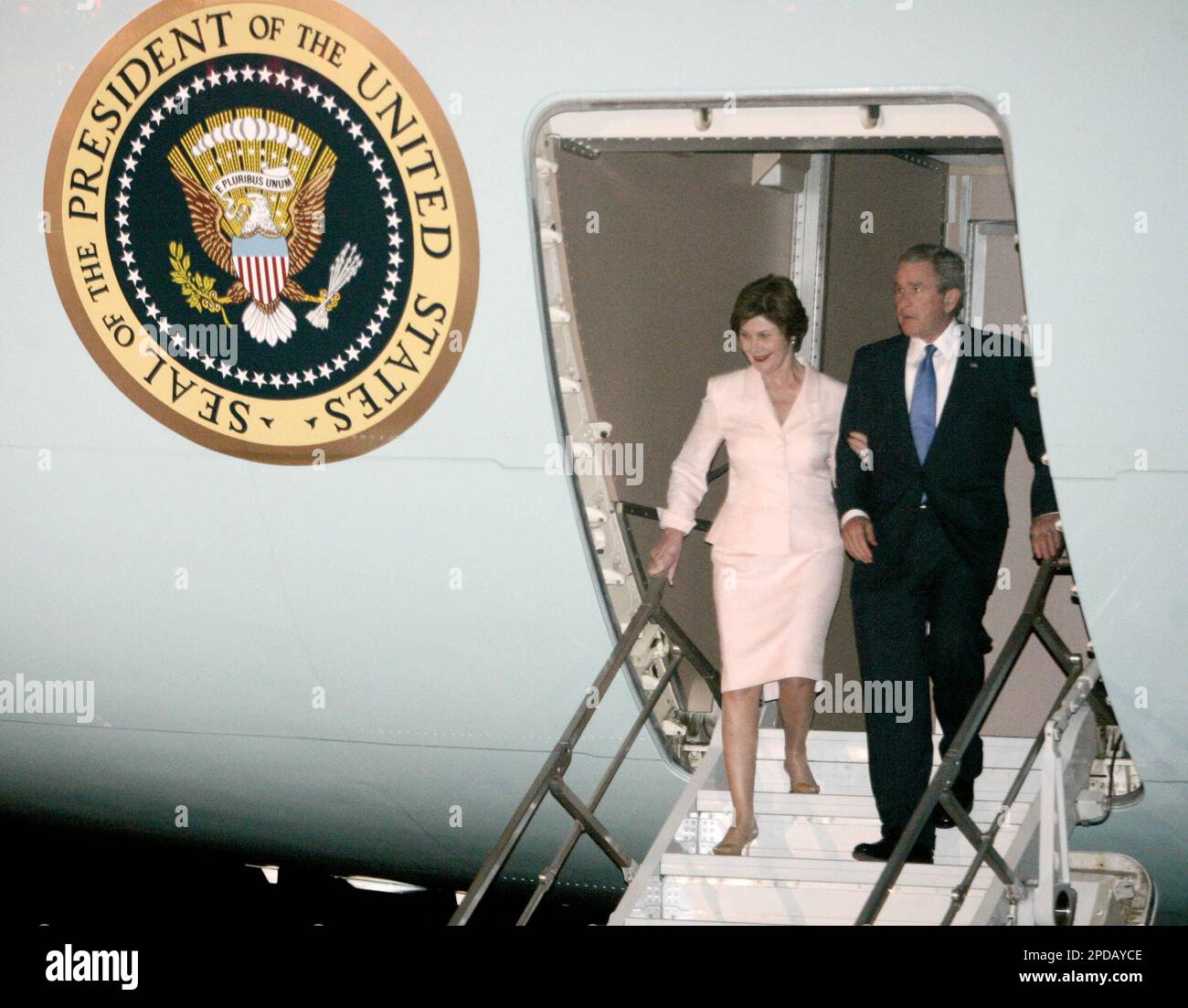U.S. President George W. Bush and first lady Laura Bush arrive in ...