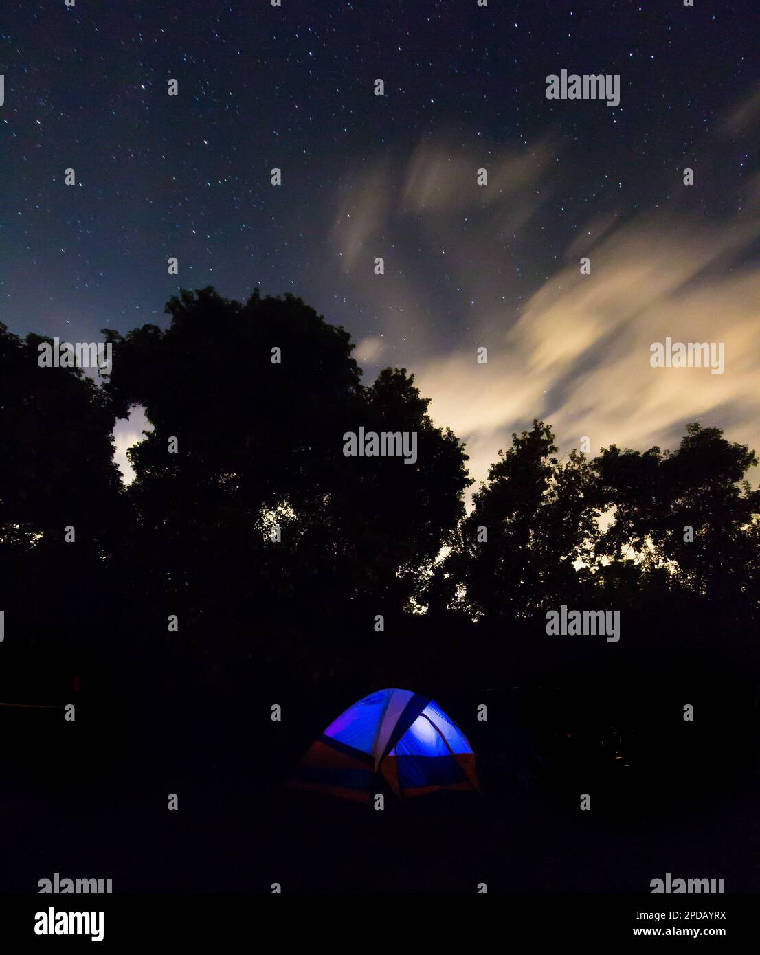 A tent at night with a light on inside the tent Stock Photo - Alamy