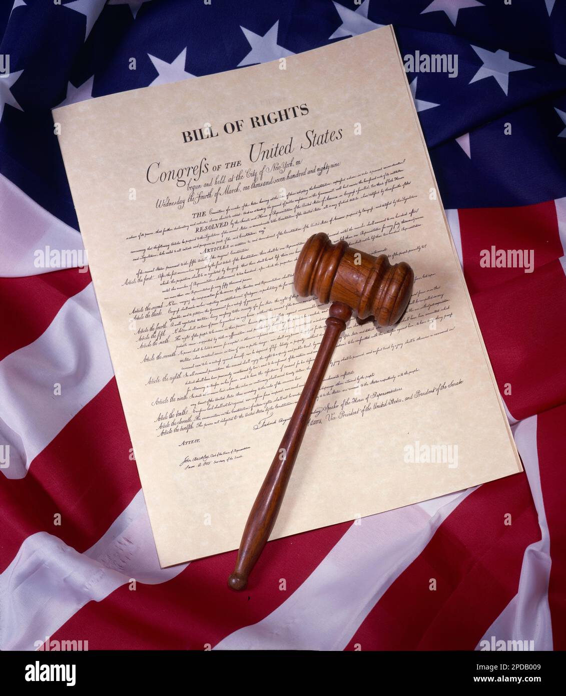 Copy of the bill of rights with a gavel on it. Lying on the US flag ...
