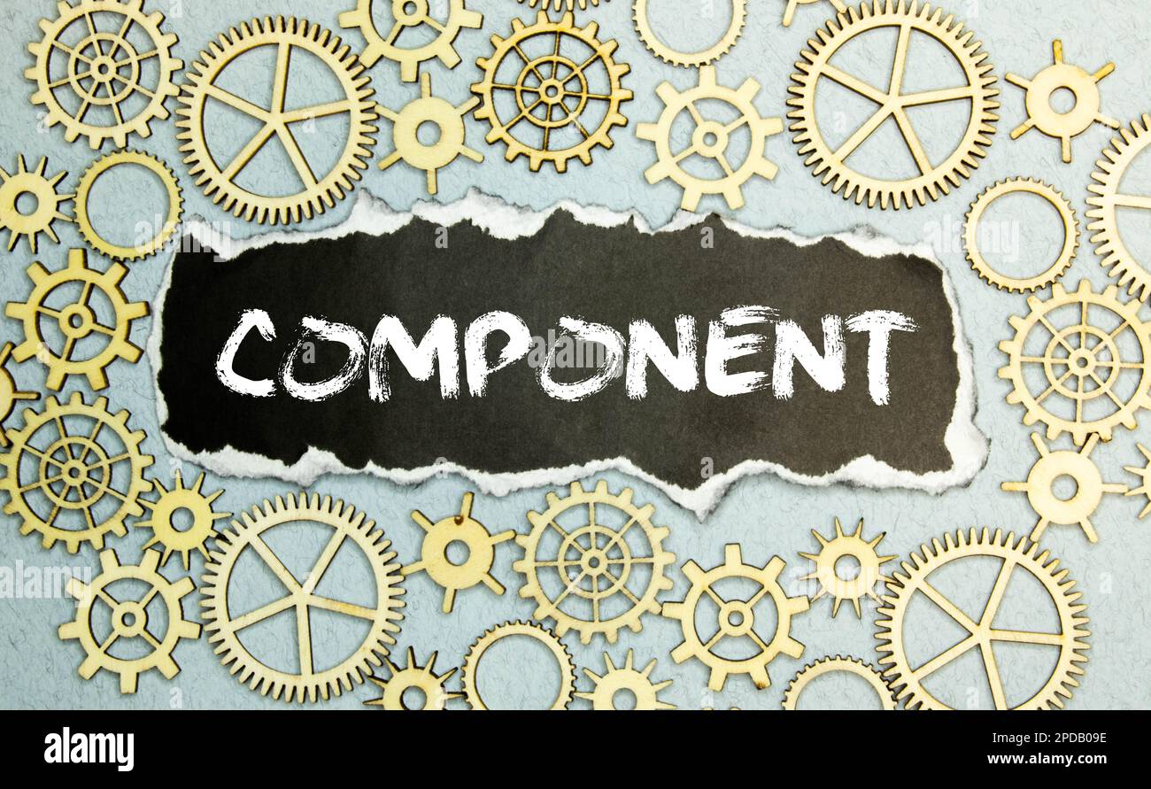 gray word component made of wooden square letters on brown background ...