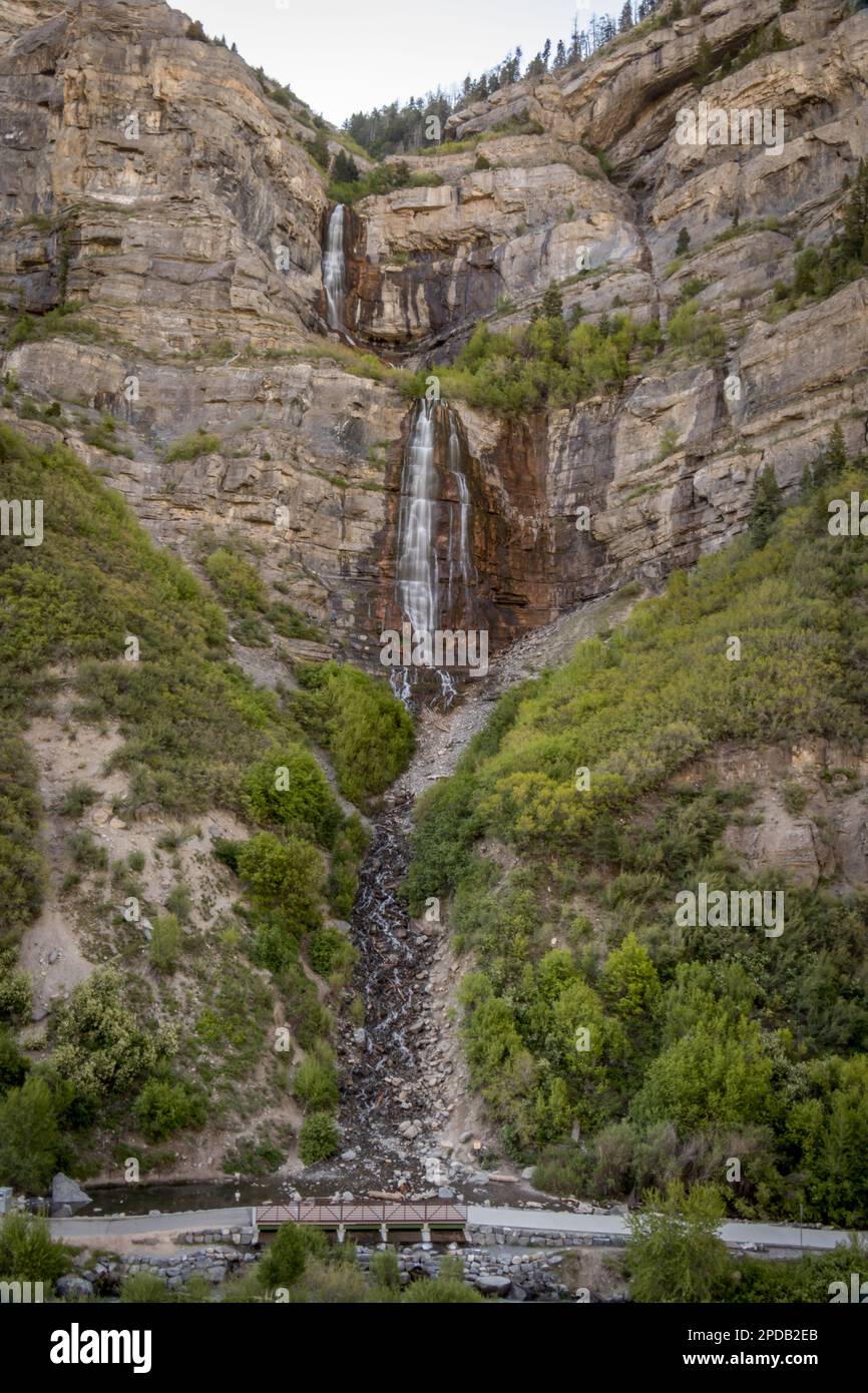 Two level waterfall with bridge spanning across river at bottom Stock ...