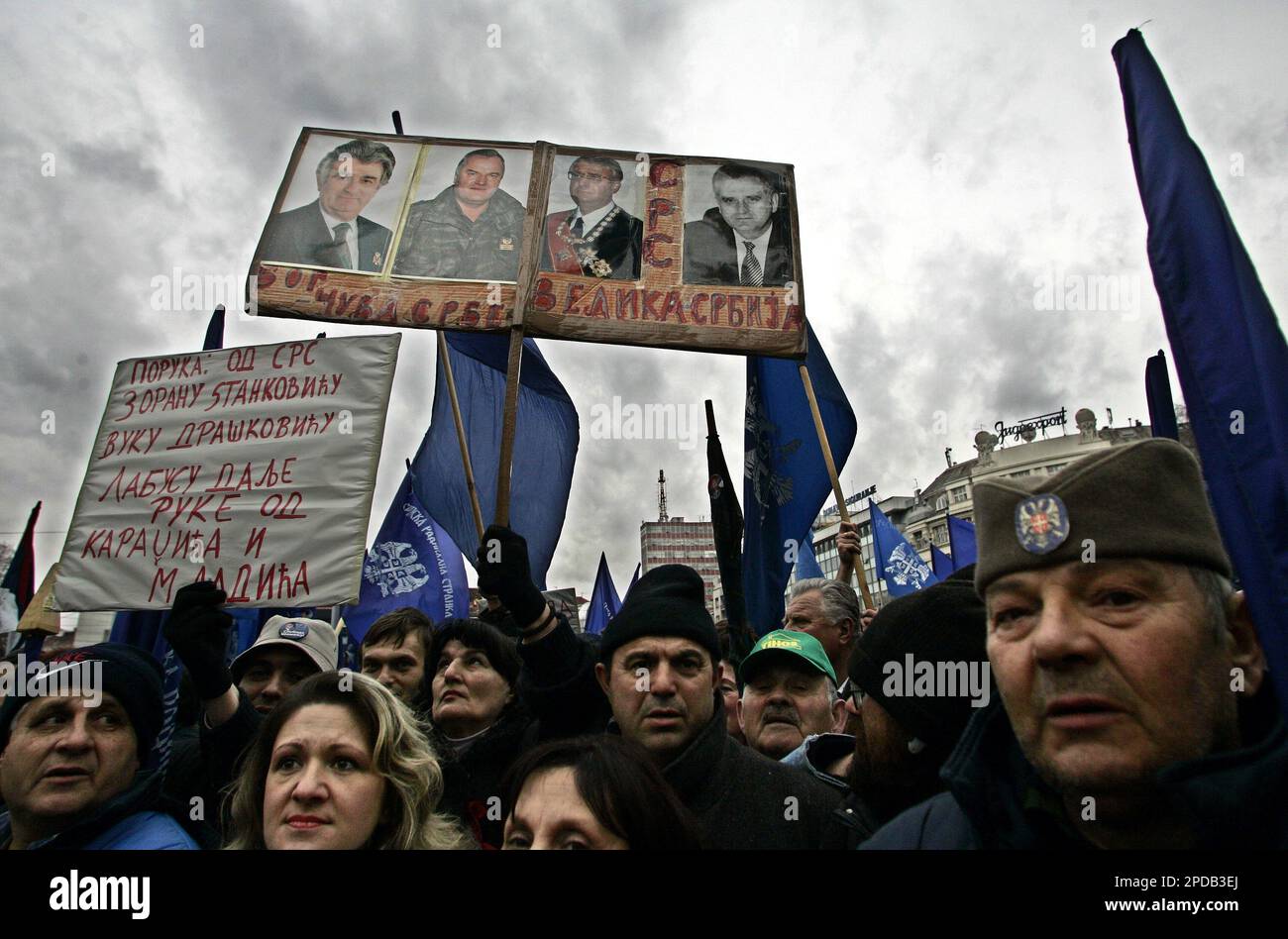 **FILE** A crowd of Serbian Radical Party supporters shows pictures of ...