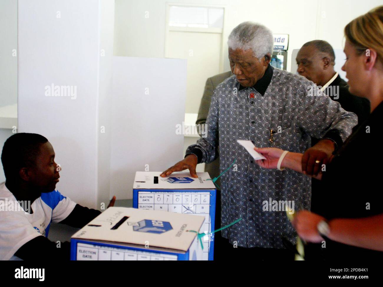Former South African President, Nelson Mandela, center, flanked by ...